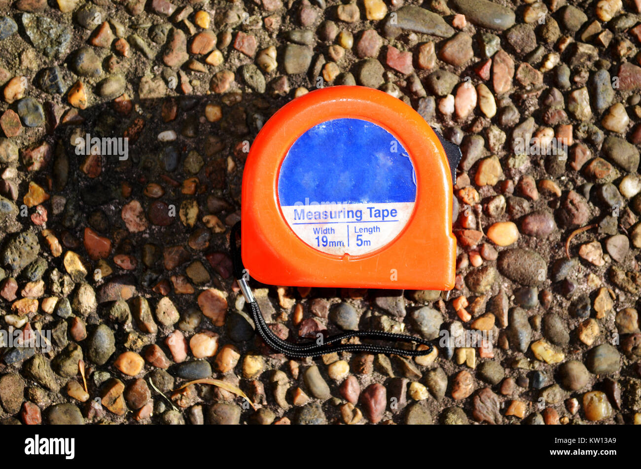 Close up of measuring tape on the ground Stock Photo - Alamy