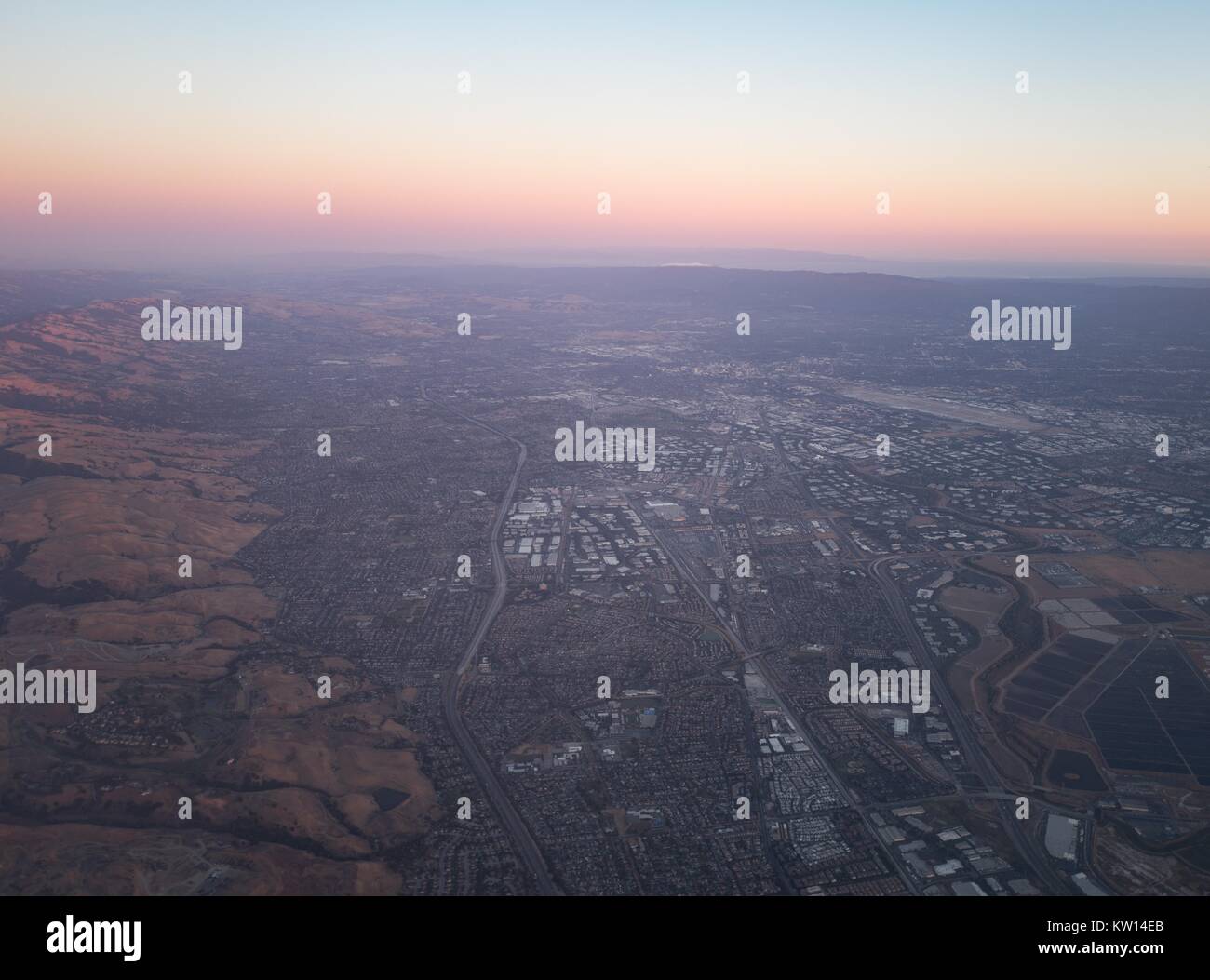 Aerial view of Silicon Valley at dusk, including the towns of Milpitas ...