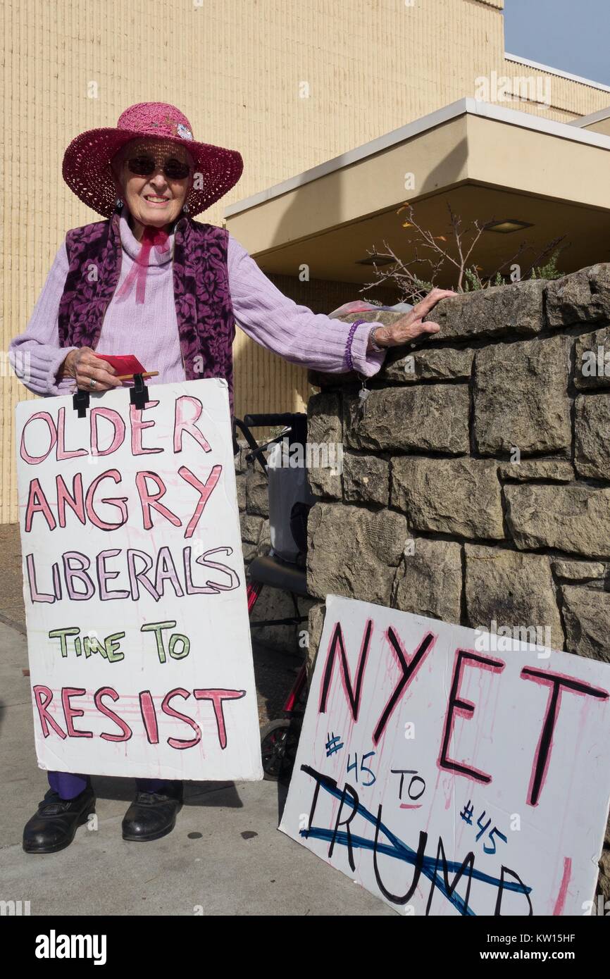 A 92 year old woman holds a sign at the weekly protest held every ...