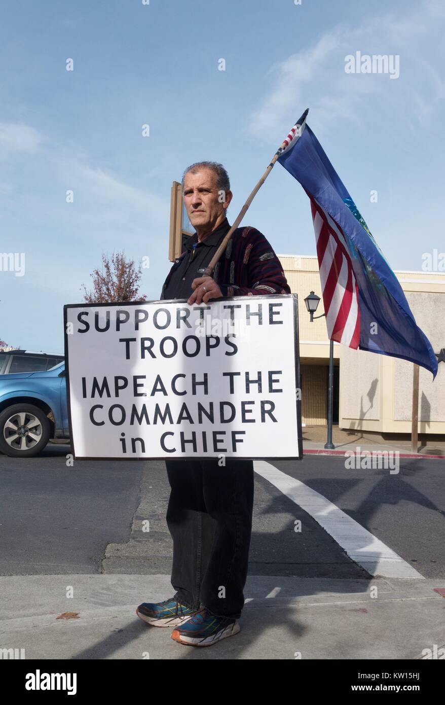 Man holding sign at protest hi-res stock photography and images - Alamy