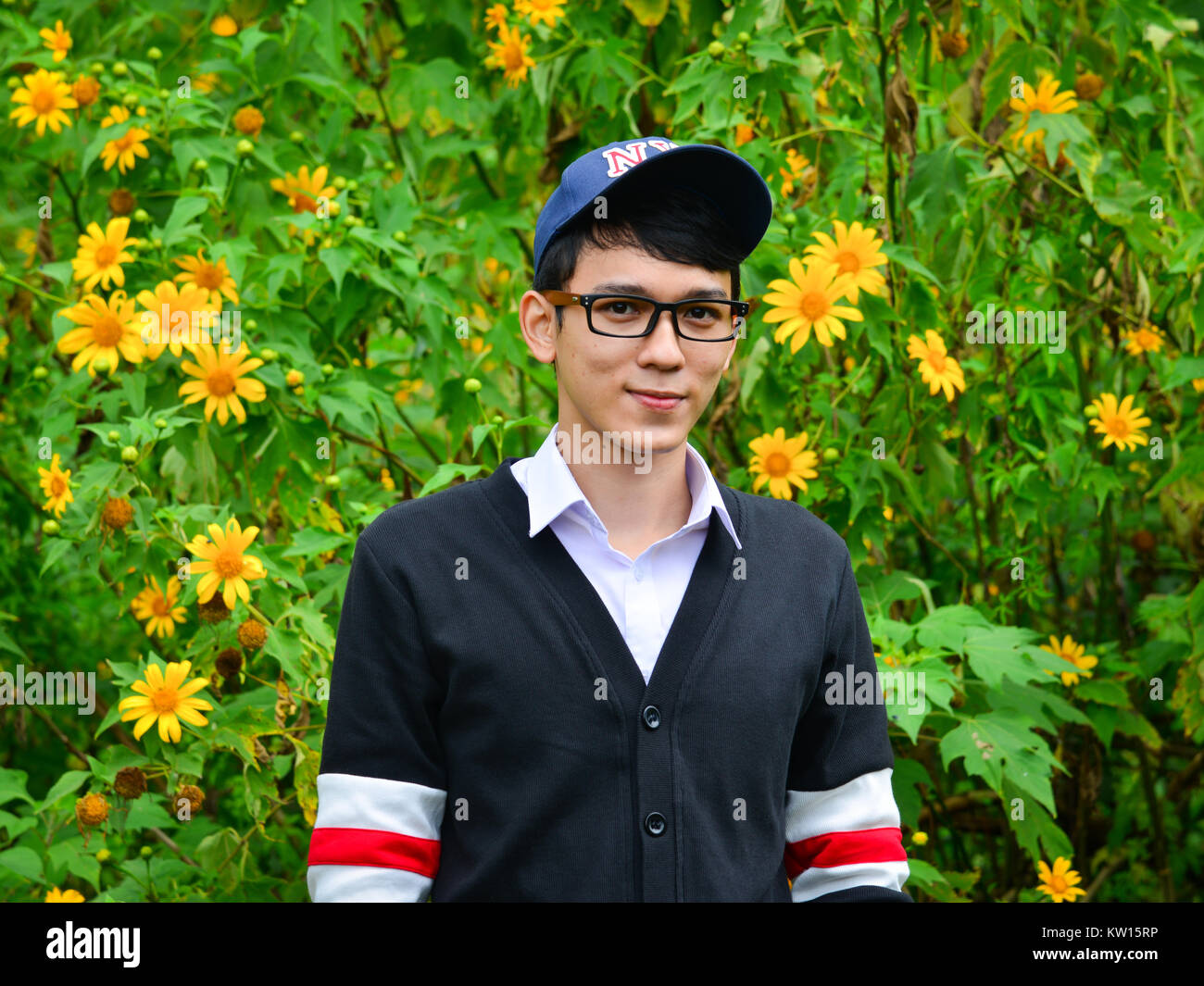 Portrait of an Asian man with nature background Stock Photo - Alamy