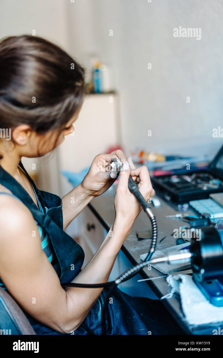 The girl is engaged in jewelry business Stock Photo - Alamy