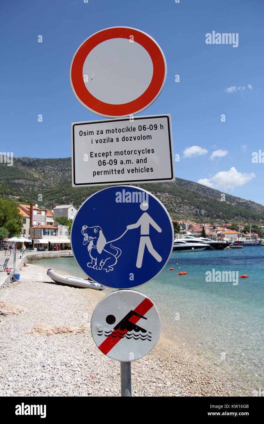 Signs on the beach in Bol, Brach island, Croatia Stock Photo - Alamy