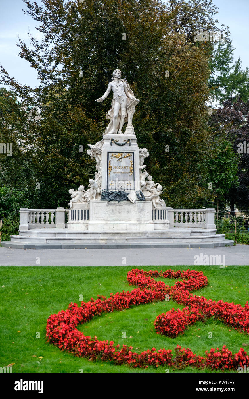 Mozart statue in the Burggarten, with treble clef on lawn made from red ...