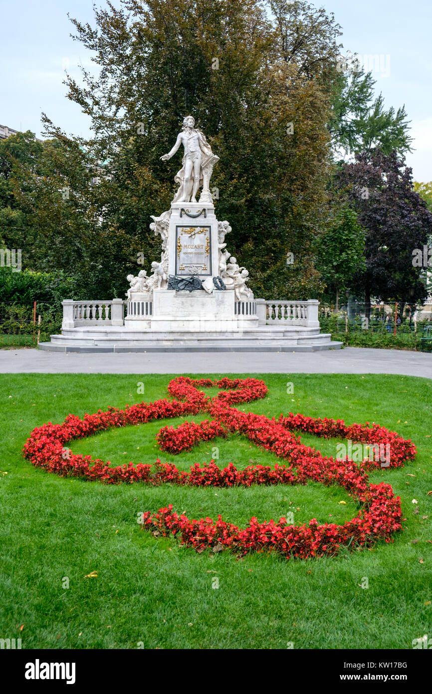 Mozart statue in the Burggarten, with treble clef on lawn made from red ...
