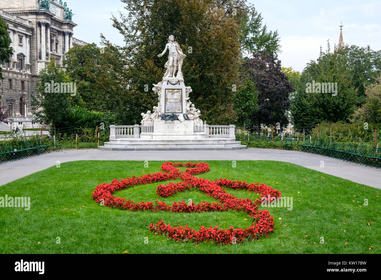 Mozart statue in the Burggarten, with treble clef on lawn made from red ...