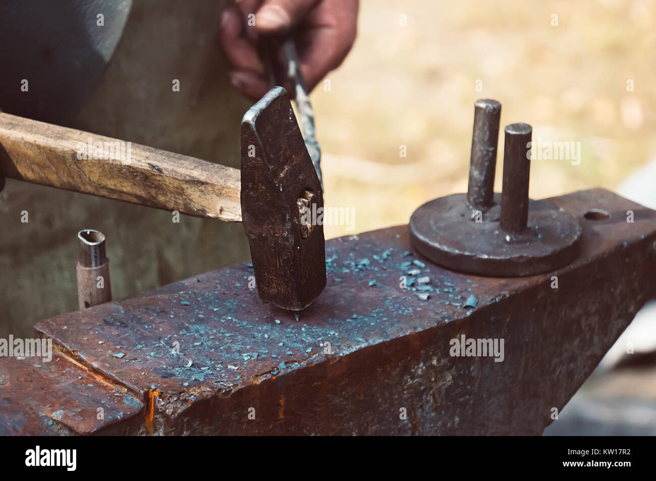 Making a decorative element in the smithy on the anvil. Forging hammer ...