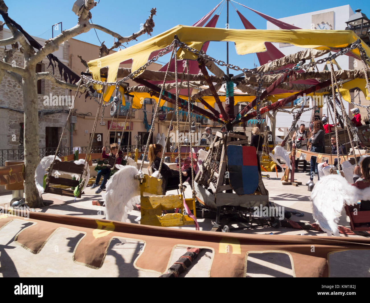 medieval childrens carousel during mediaval festival in Lliber village ...