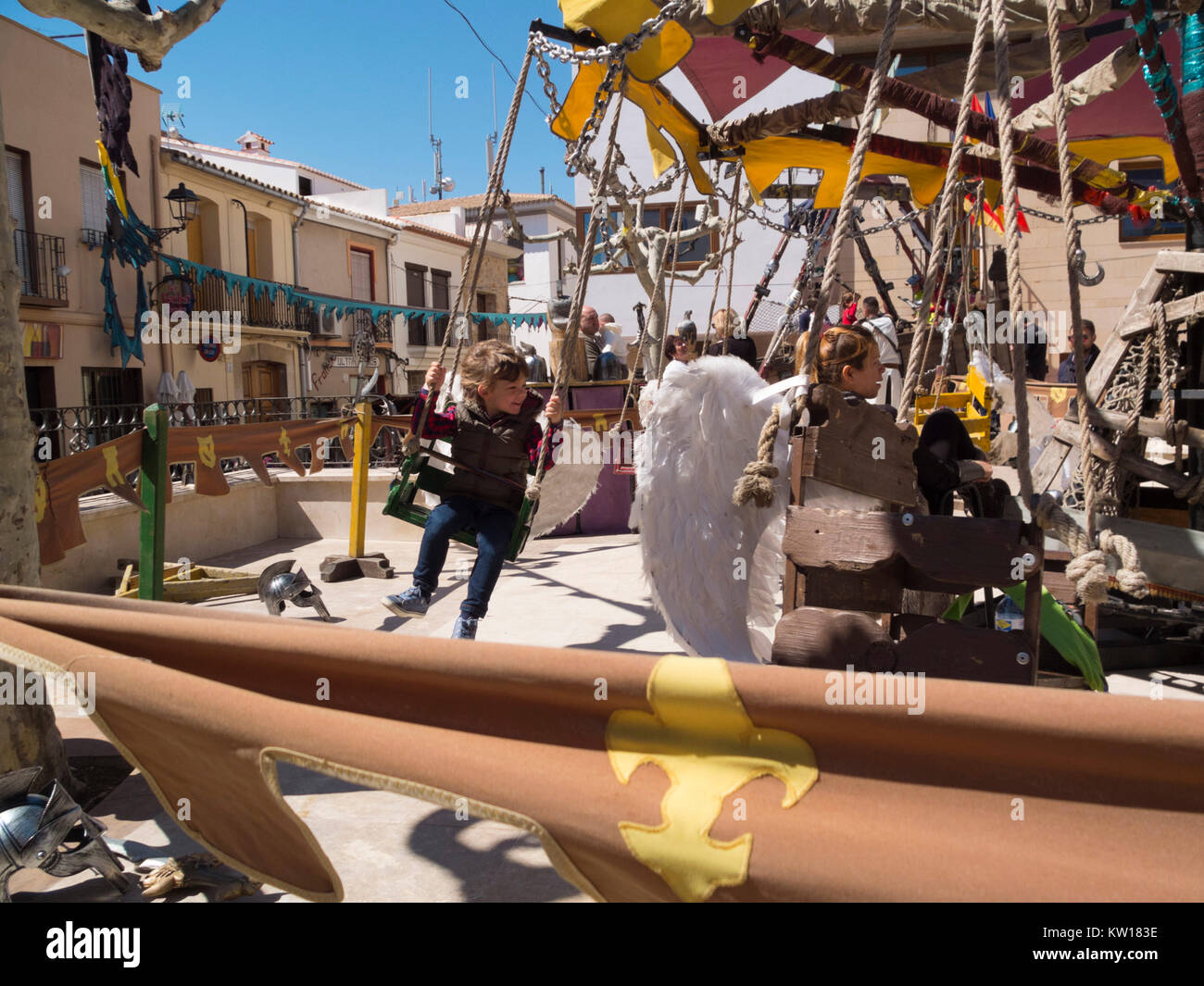 medieval childrens carousel during mediaval festival in Lliber village ...