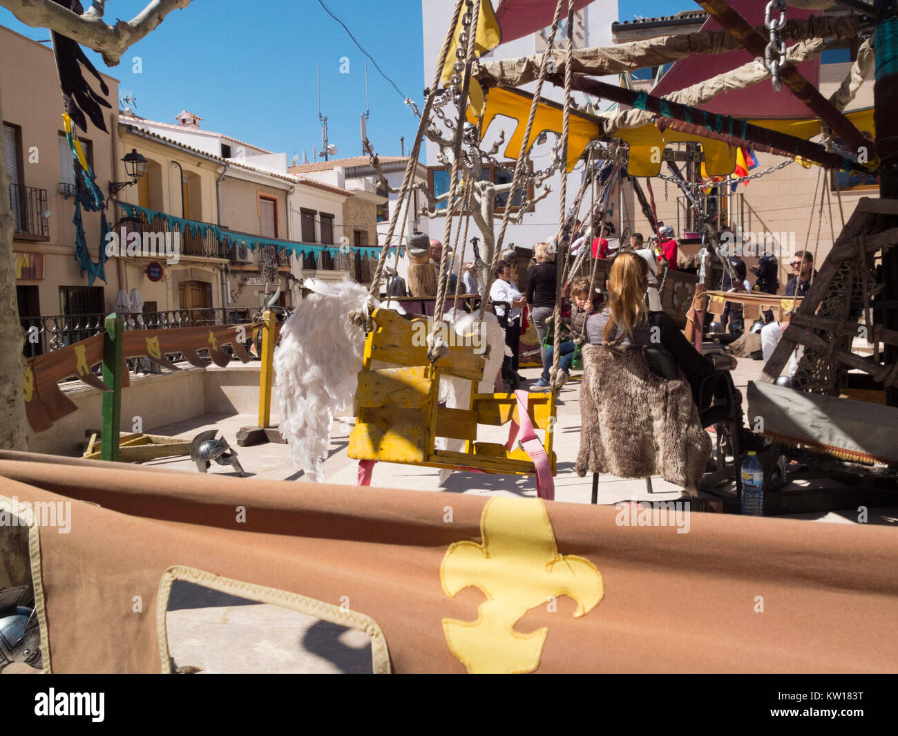 medieval childrens carousel during mediaval festival in Lliber village ...