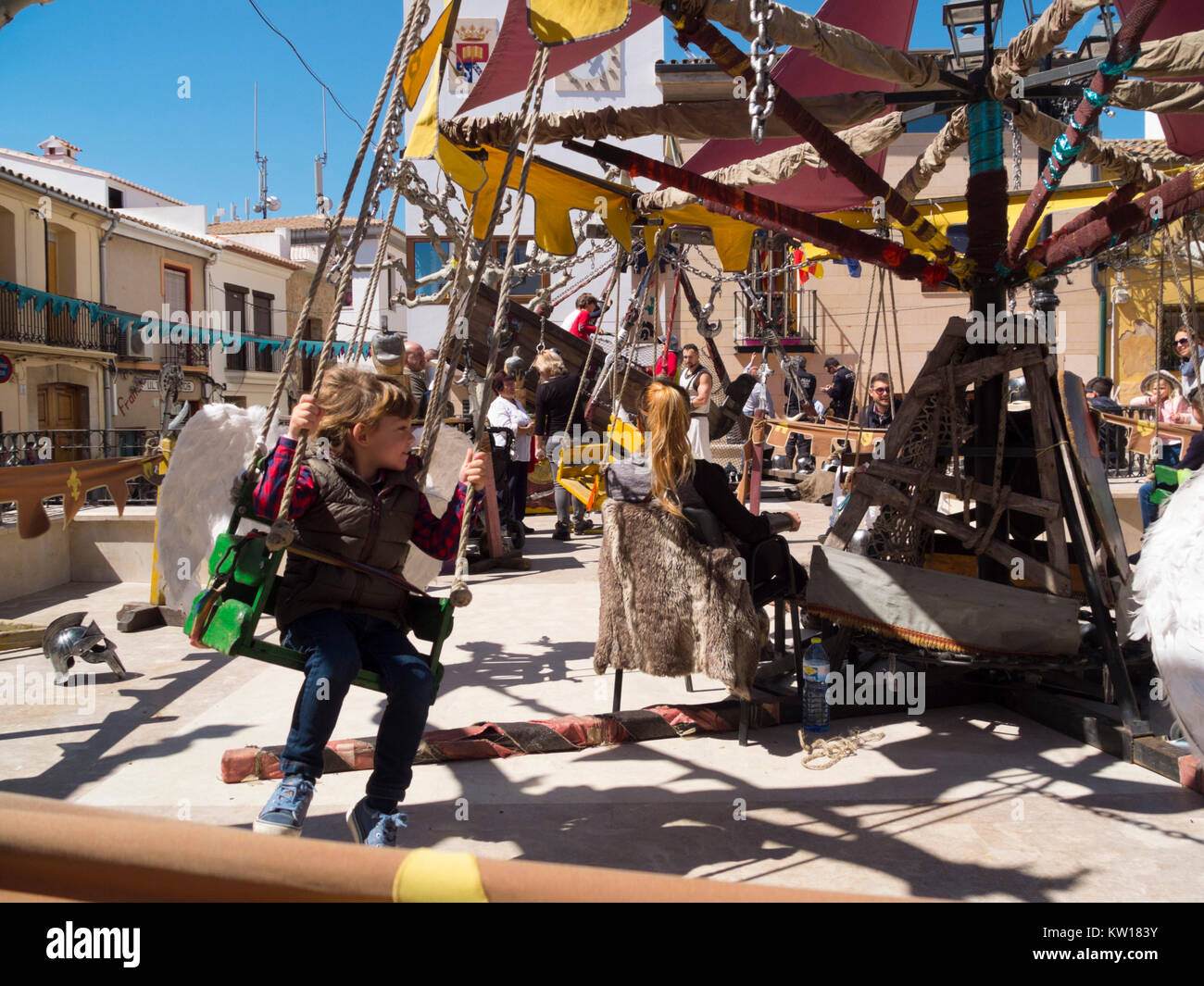 medieval childrens carousel during mediaval festival in Lliber village ...