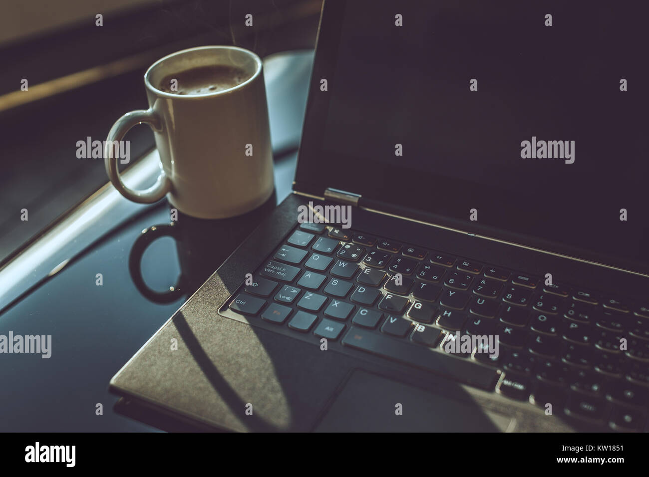 Cup of coffee and laptop Stock Photo - Alamy