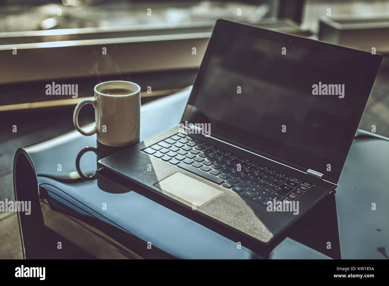 Cup of coffee and laptop Stock Photo - Alamy