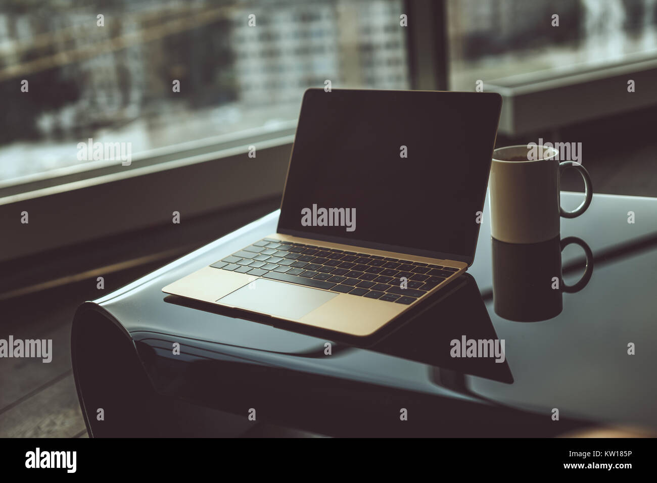 Cup of coffee and laptop Stock Photo - Alamy