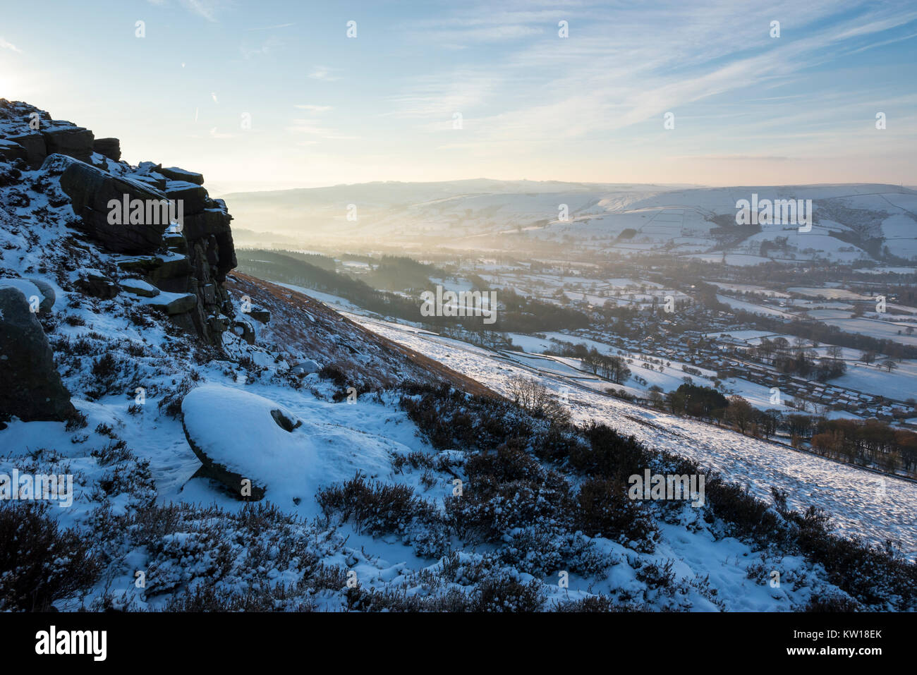 Dawn at Bamford edge in the Peak District on a cold winter morning. An ...