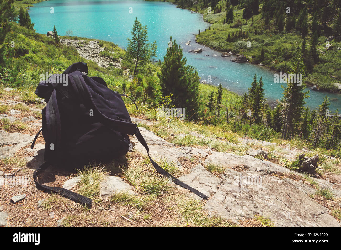 Abandoned lost backpack in the backgroundof a beautiful landscape with ...