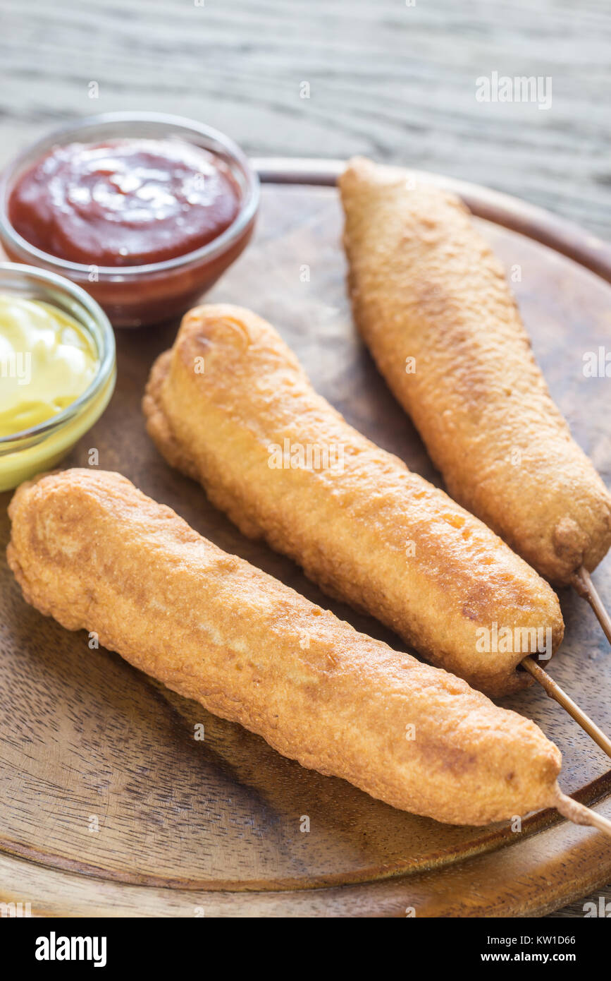Stack of corn dogs on the wooden board Stock Photo - Alamy