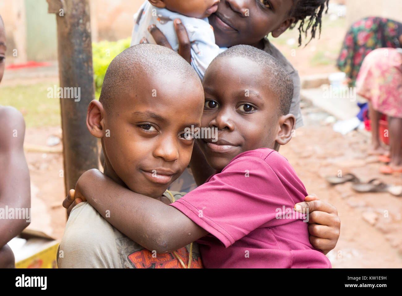 African boys hug hi-res stock photography and images - Alamy