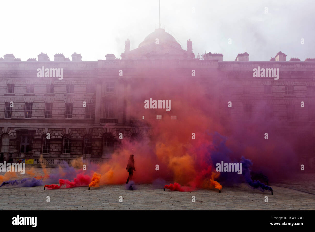 Performance artist Filippo Minelli sets off colourful smoke bombs in ...