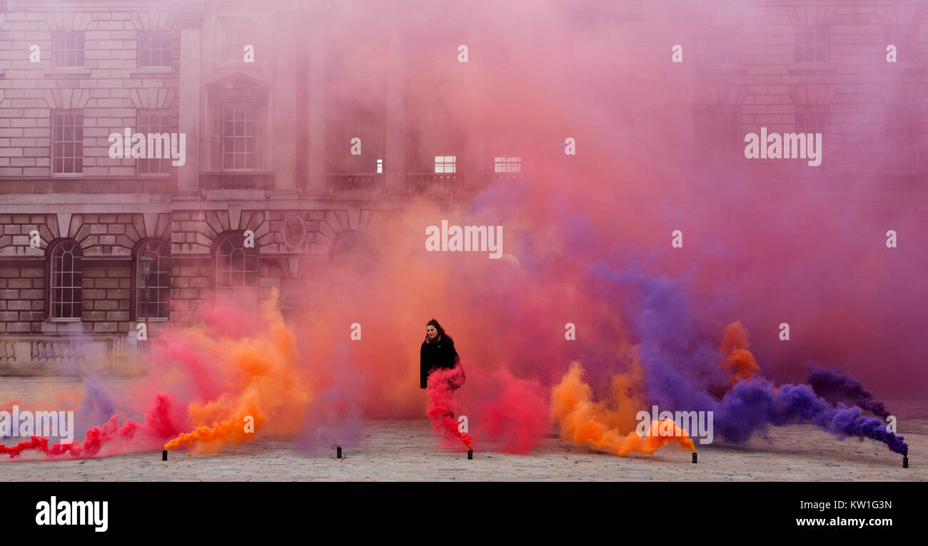 Performance artist Filippo Minelli sets off colourful smoke bombs in ...