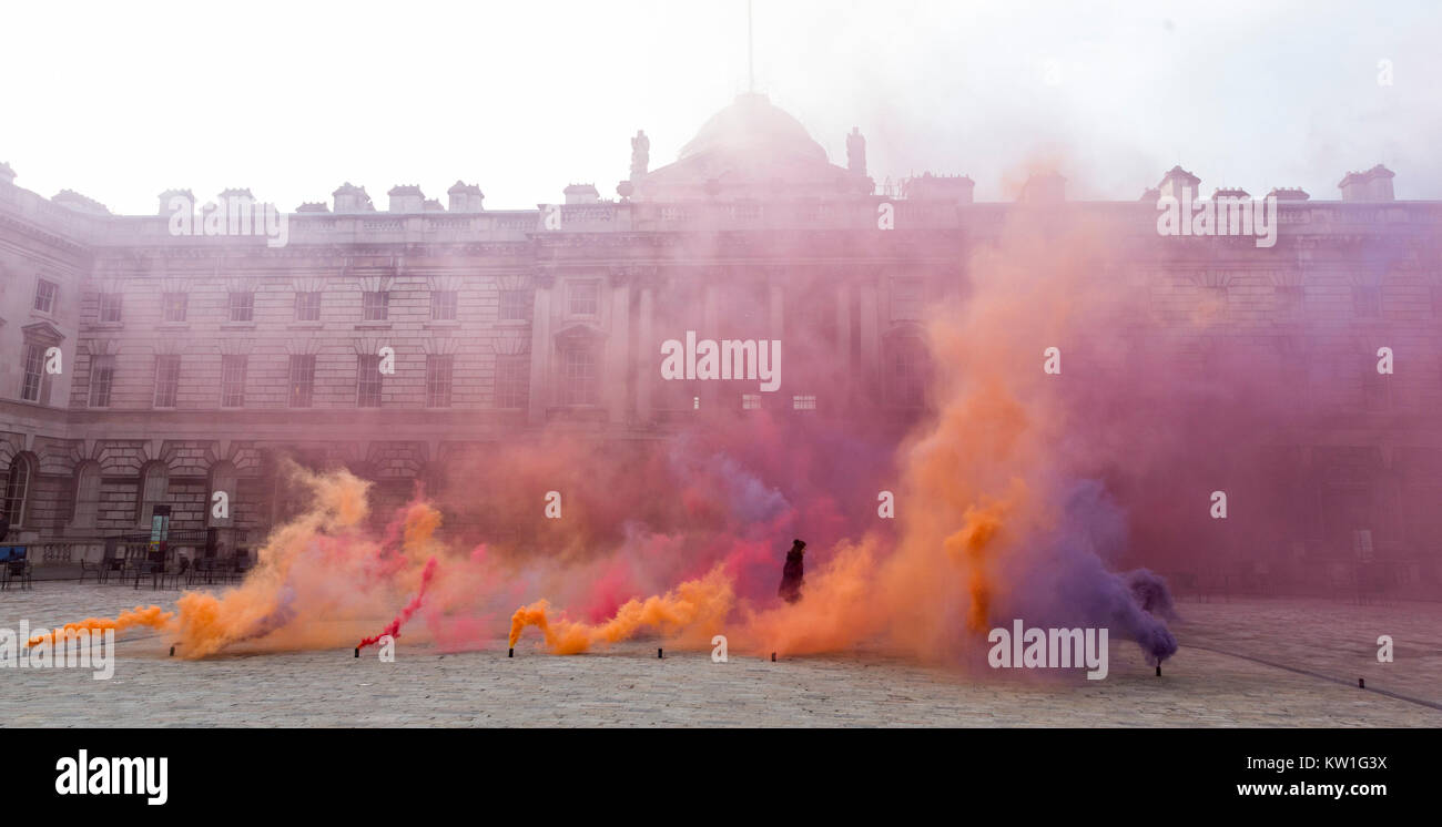 Performance artist Filippo Minelli sets off colourful smoke bombs in ...