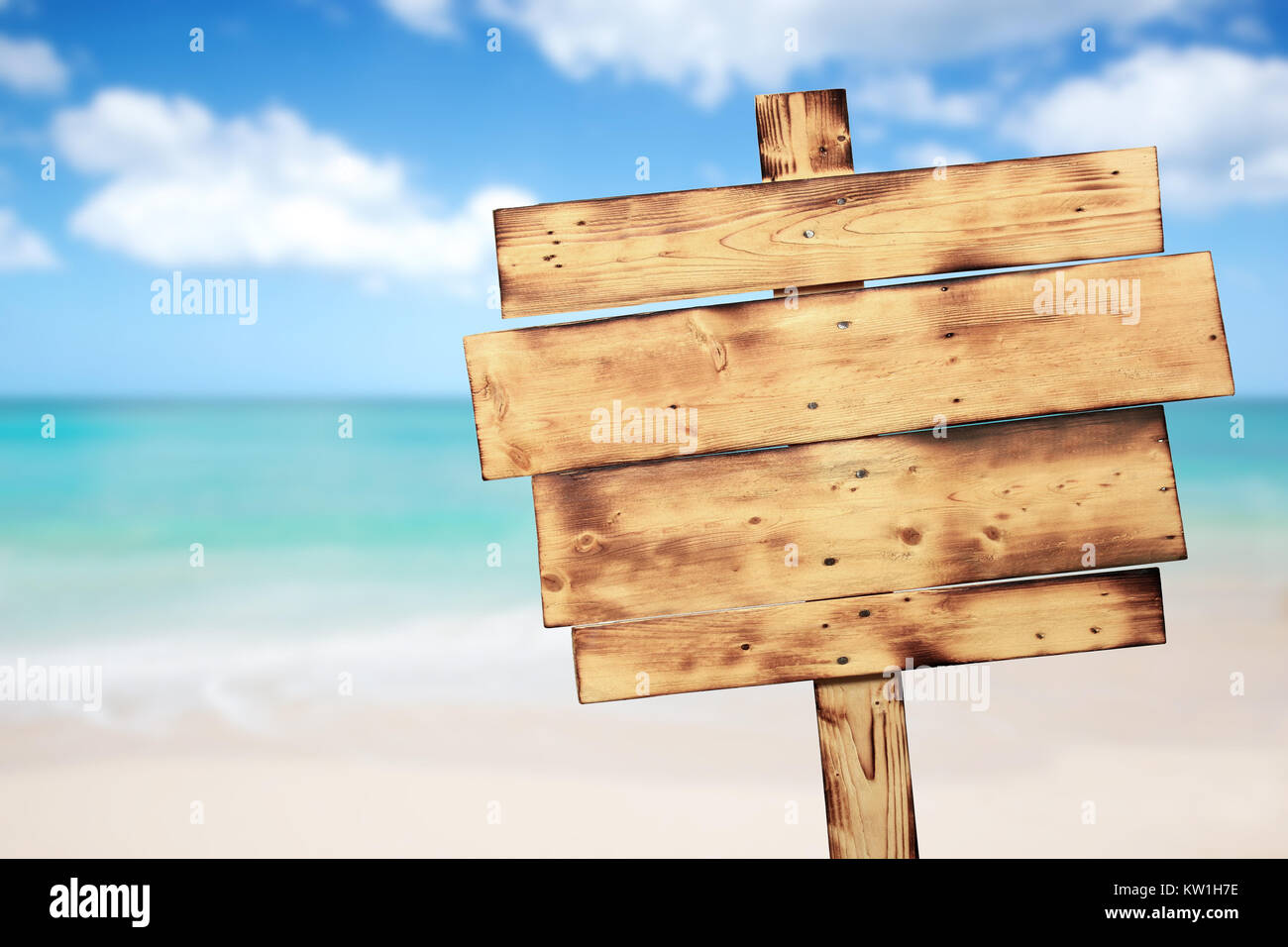 Vintage rustic wooden sign on the beach Stock Photo - Alamy