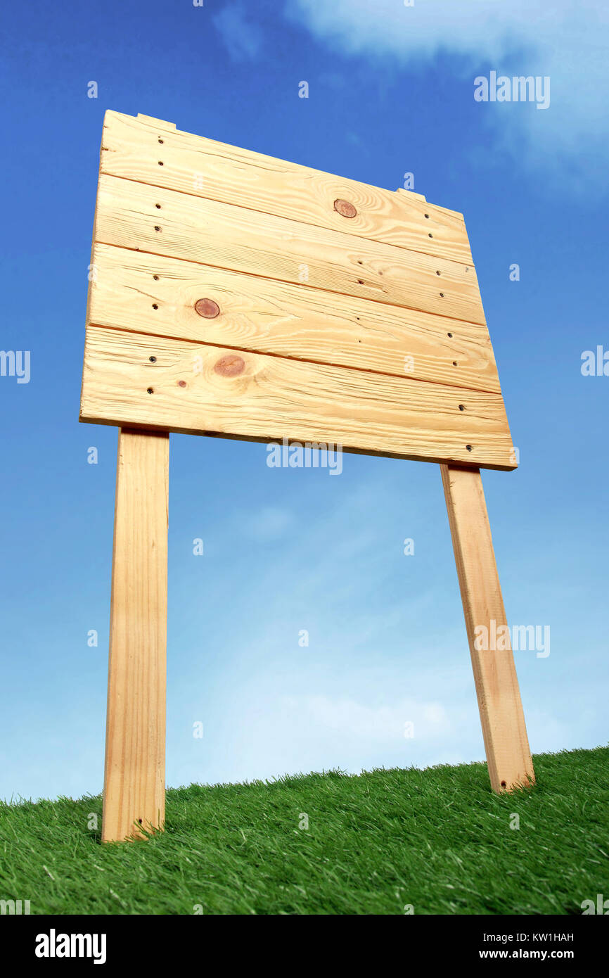 Wooden sign under the blue sky Stock Photo - Alamy