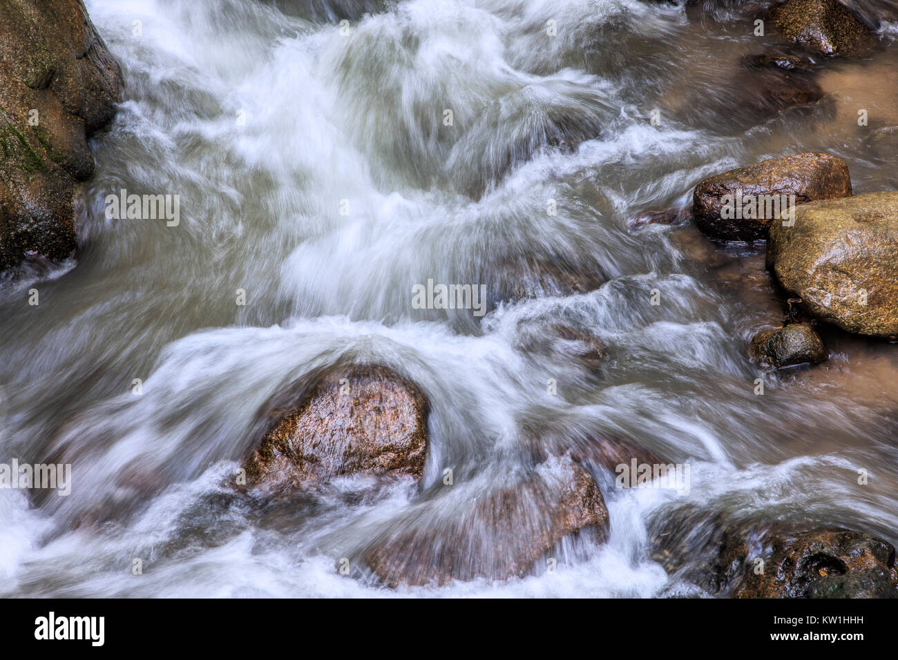 Water flowing around rocks in Roaring Fork Creek along the Roaring Fork ...