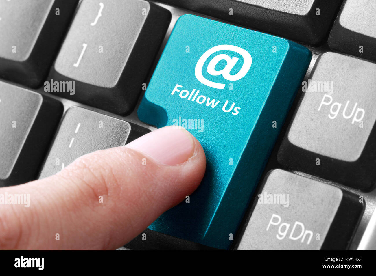 Follow us button on the keyboard Stock Photo - Alamy