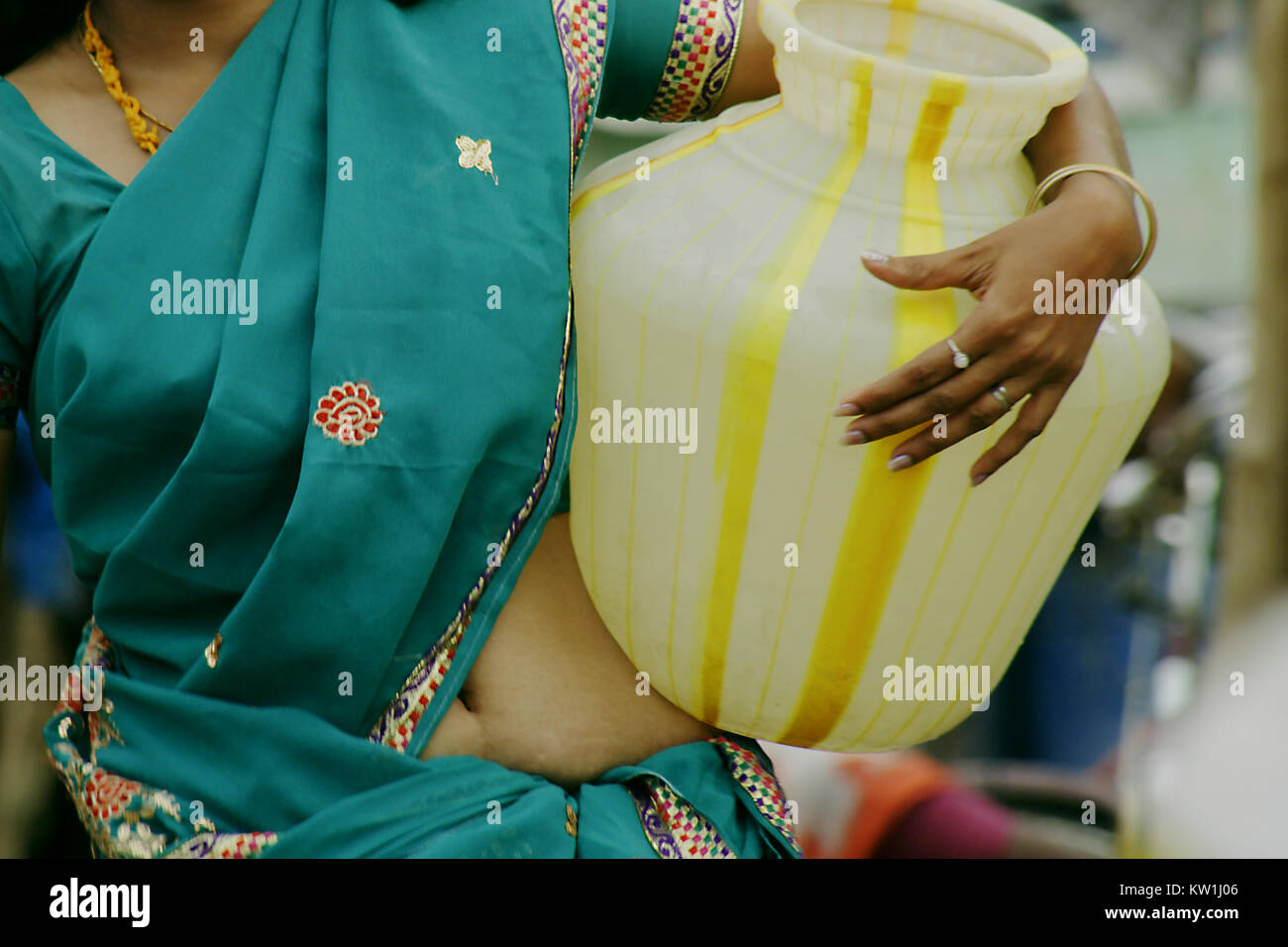 Indian girl carrying water pots hi-res stock photography and images - Alamy