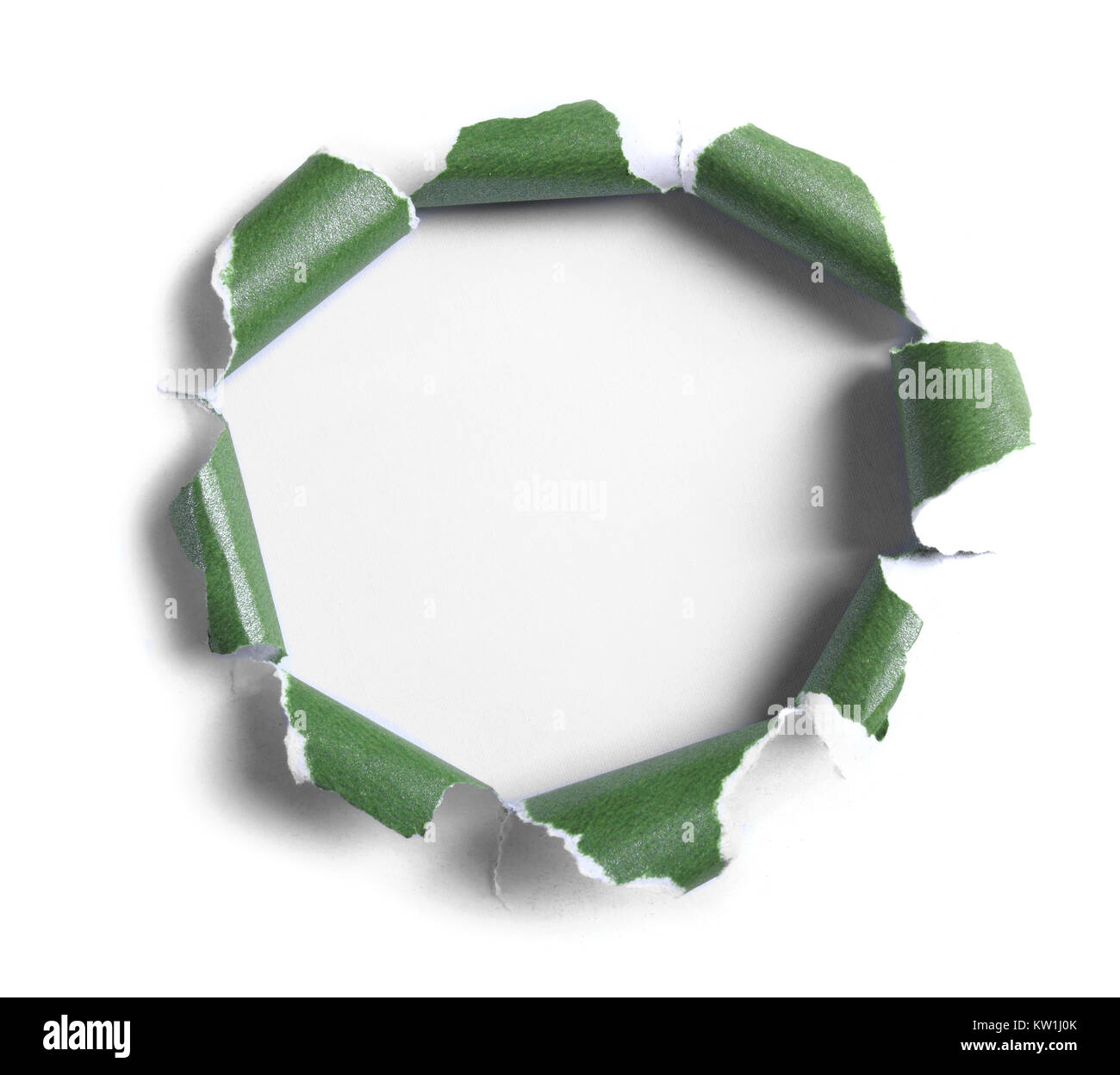 Hole ripped in white paper with green paper Stock Photo - Alamy