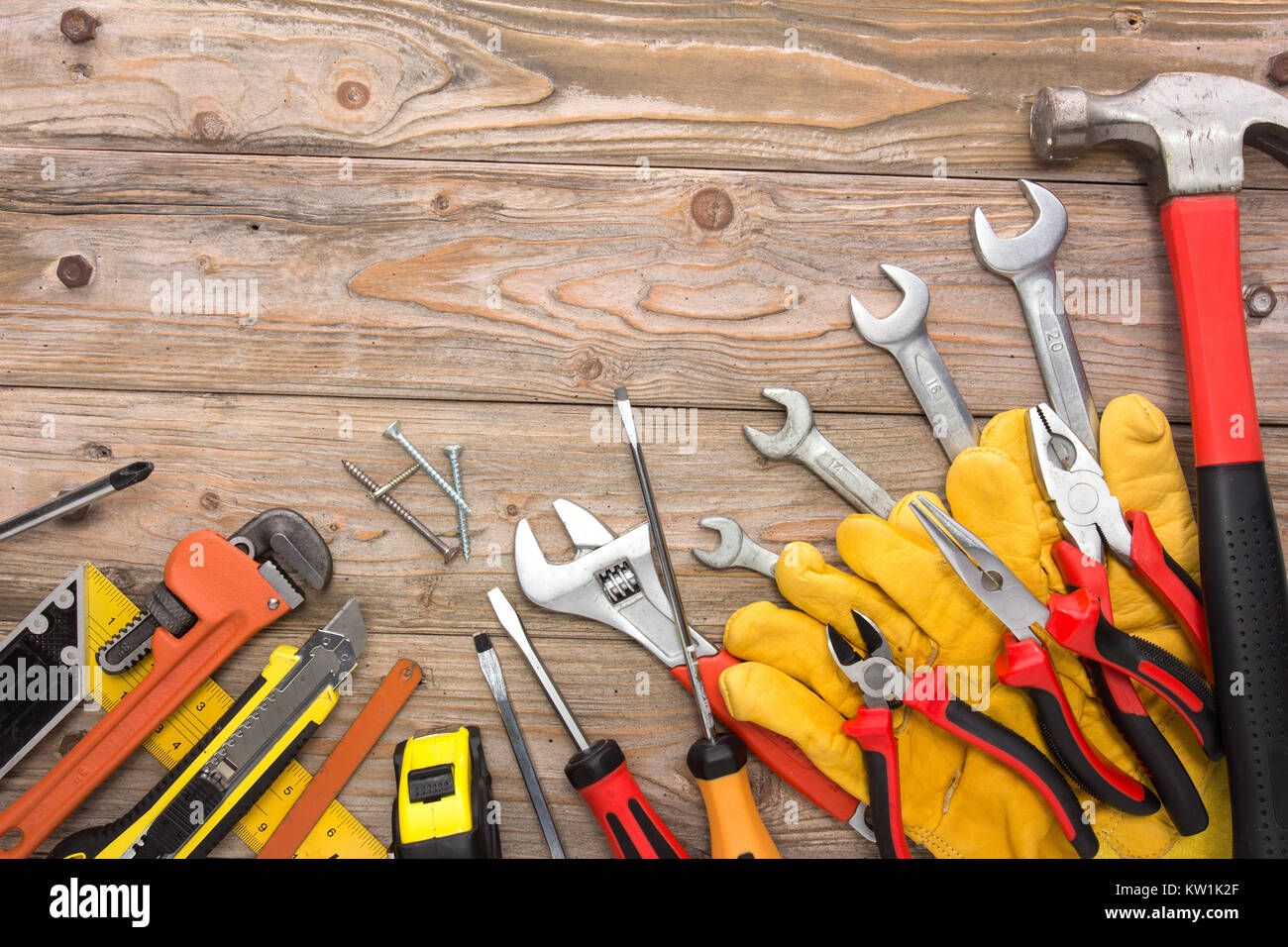mechanical kit in wooden background. construction tool Stock Photo - Alamy