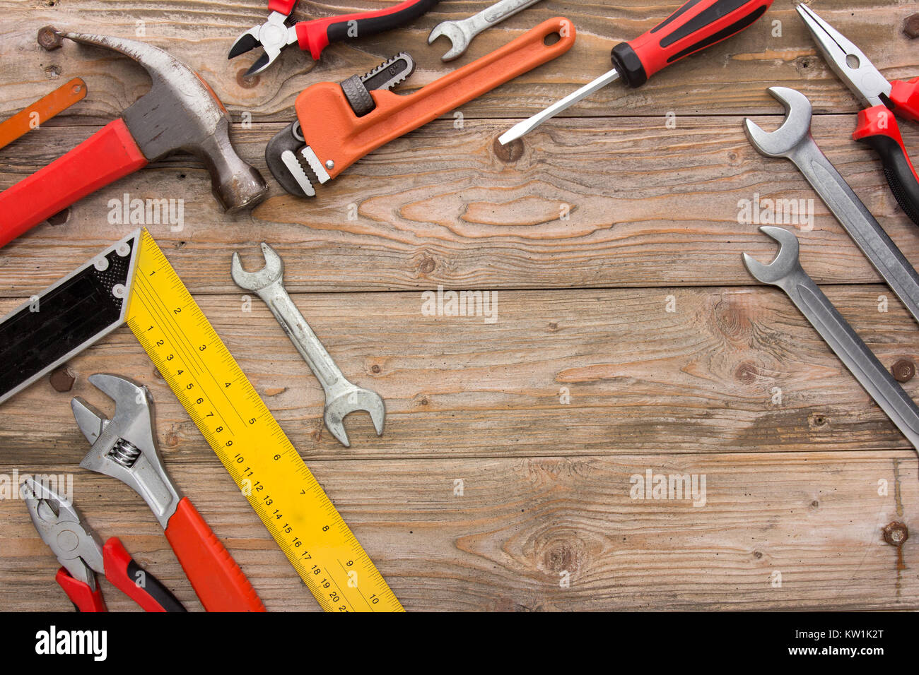 mechanical kit in wooden background. construction tool Stock Photo - Alamy