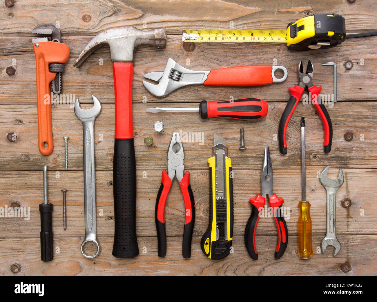 mechanical kit in wooden background. construction tool Stock Photo - Alamy