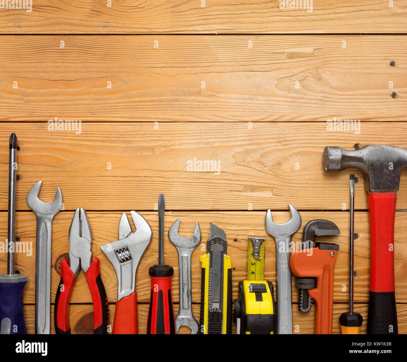 Set of tools over a wood panel Stock Photo - Alamy