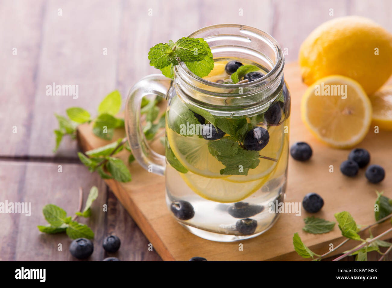 Summer fresh fruit drink. fruit Flavored water mix with lemon, b Stock ...