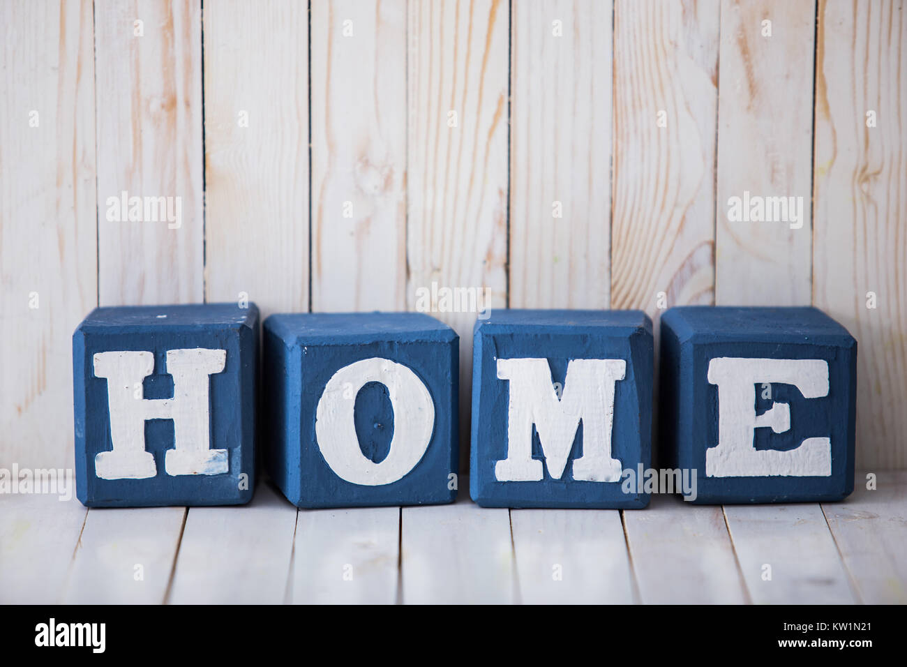 HOME sign made of wooden blocks on wooden background Stock Photo - Alamy