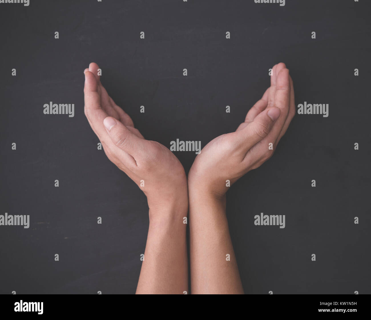 Hands try to protect/ catching something, hand gesture Stock Photo - Alamy