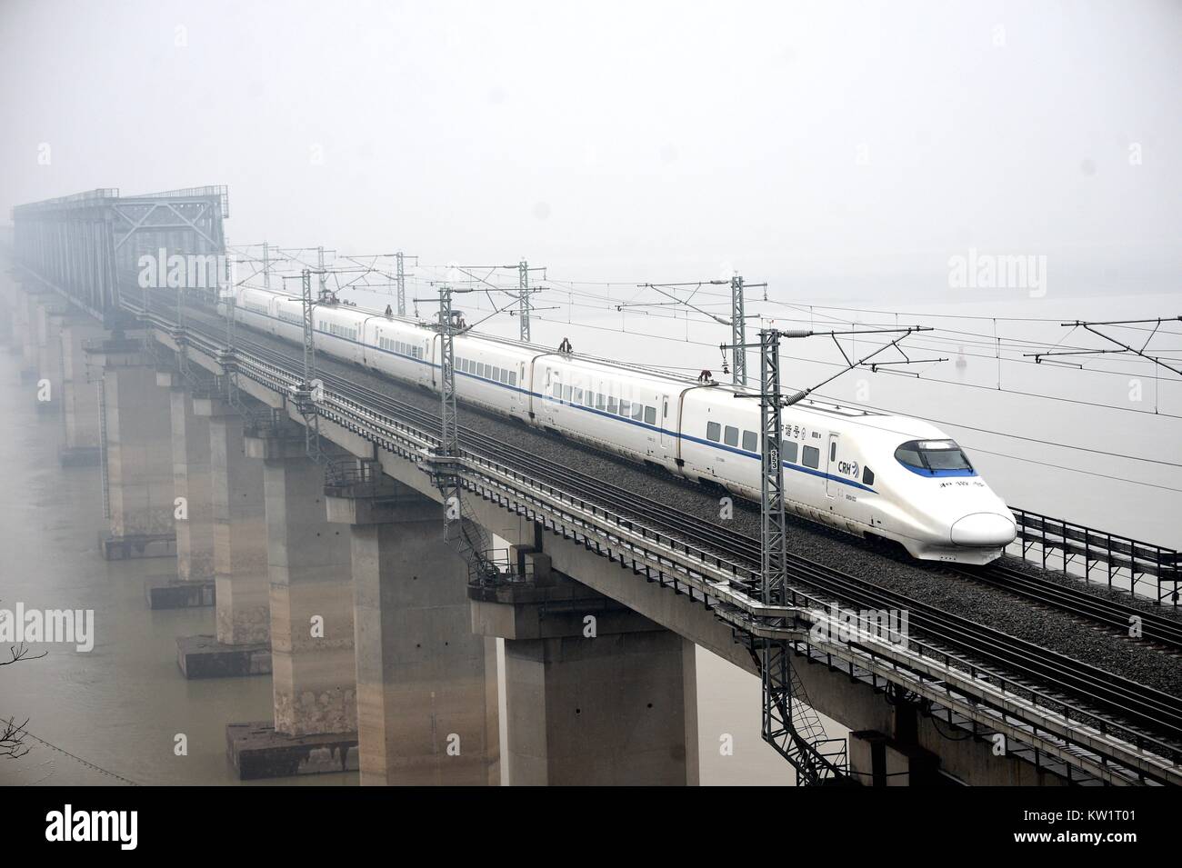 Jiujiang, China's Jiangxi Province. 28th Dec, 2017. A bullet train ...