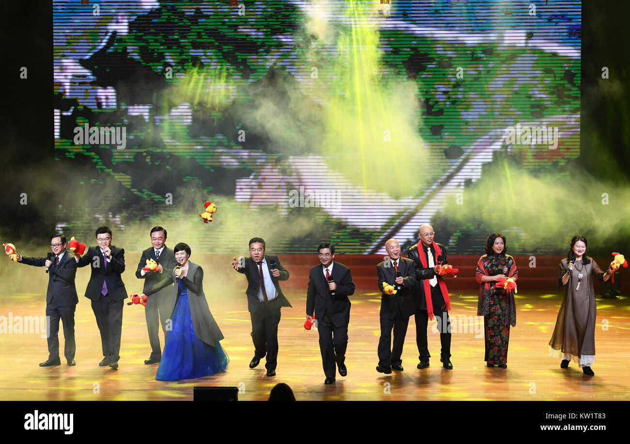 Chongqing. 28th Dec, 2017. Teachers sing during the New Year Party in ...