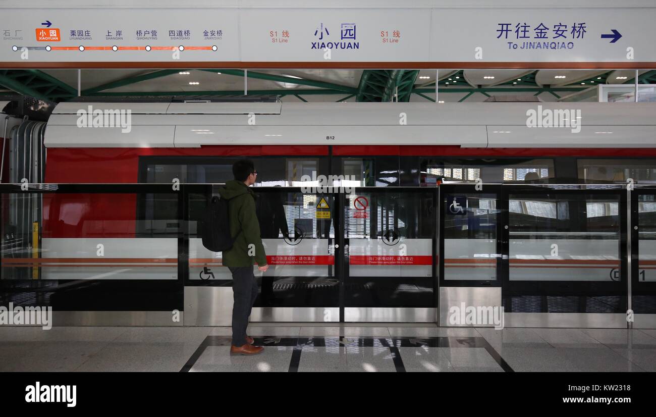Beijing, China. 30th Dec, 2017. A maglev train arrives at Xiaoyuan ...