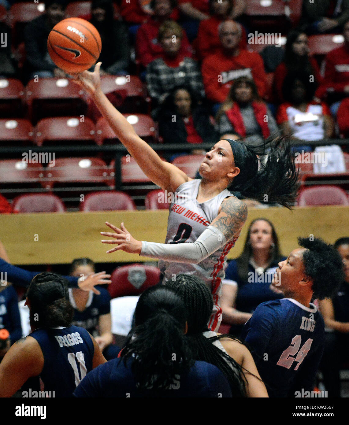 Albuquerque, NM, USA. 30th Dec, 2017. UNM's # 0 Cherise Beyond lays up ...