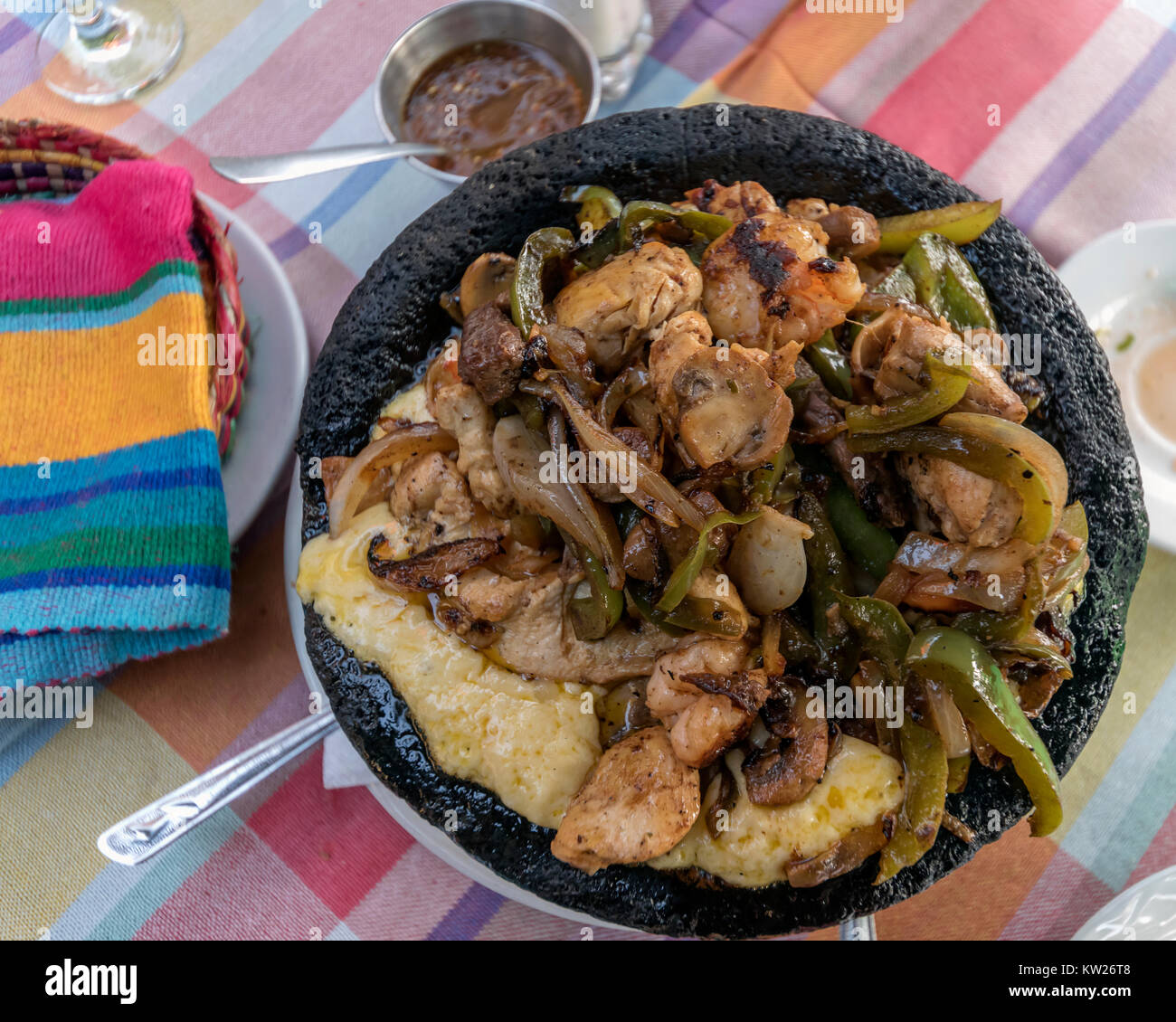 Molcajete (lava bowl) meat and vegetable dish, Ajijic, Jalisco, Mexico ...
