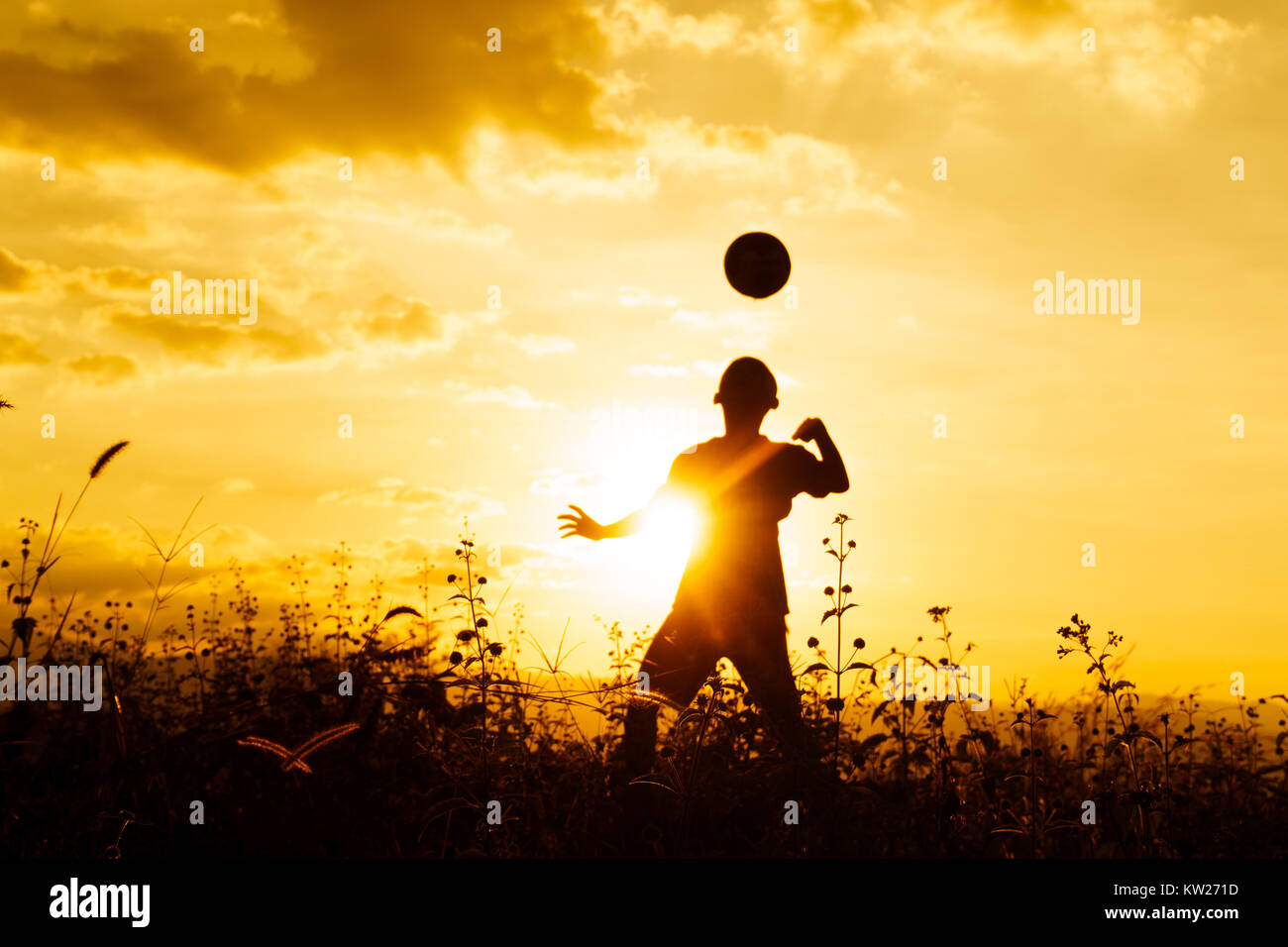 Shadows play football at sunset,Yellow tone Stock Photo - Alamy