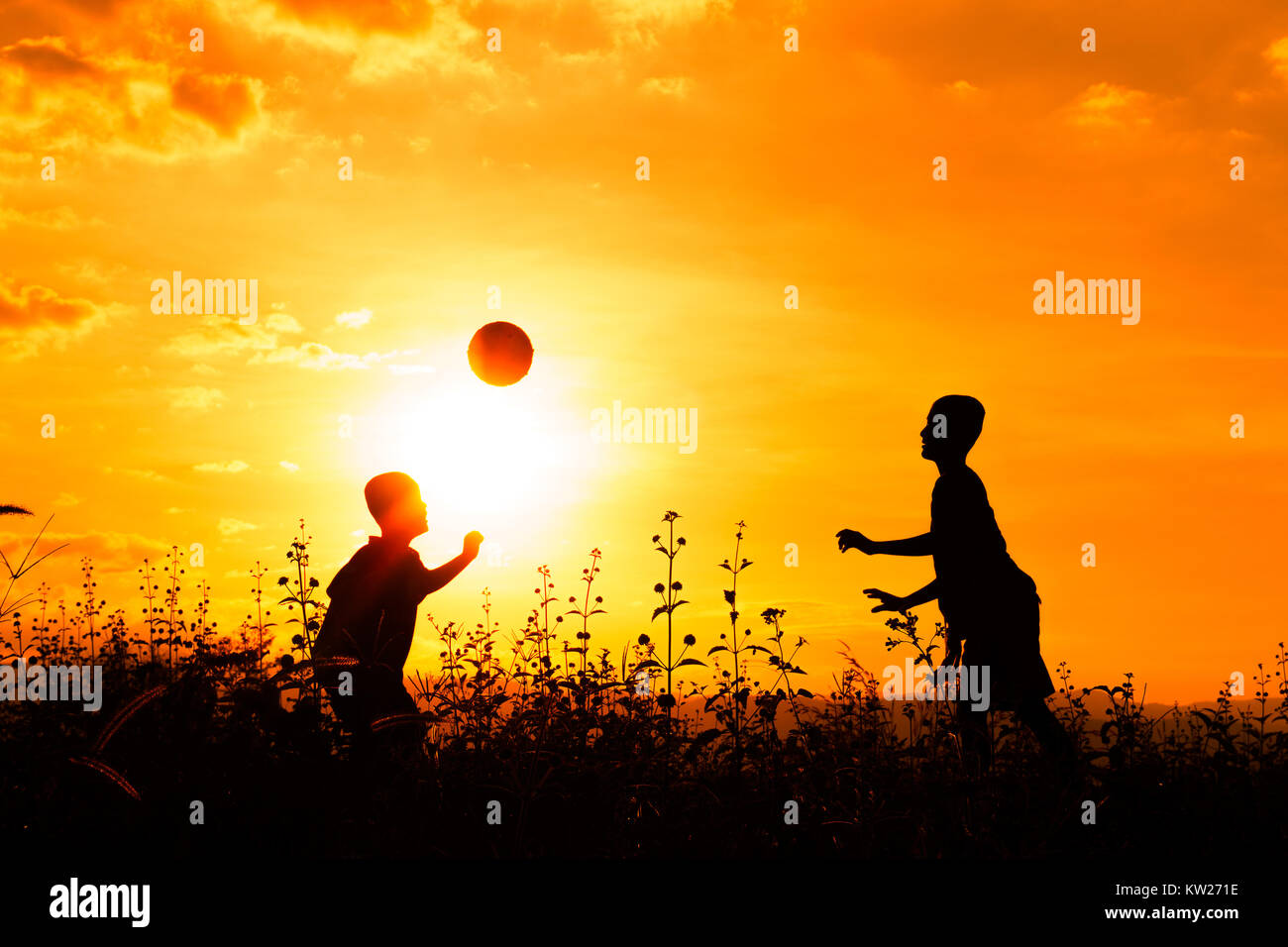 Shadows play football at sunset,Yellow tone Stock Photo - Alamy