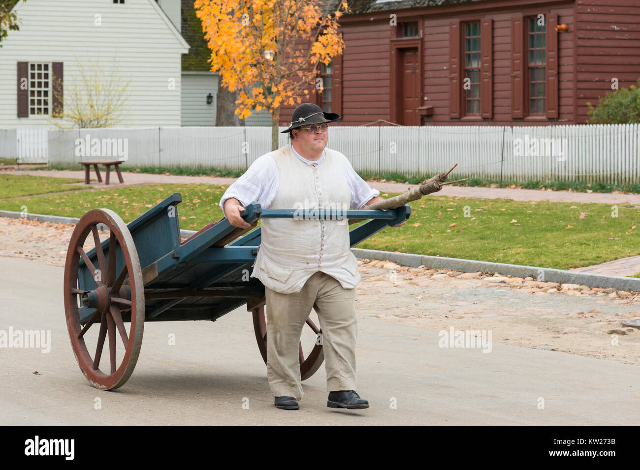 Costumed interpreter pulling handcart on Duke of Gloucester Street ...