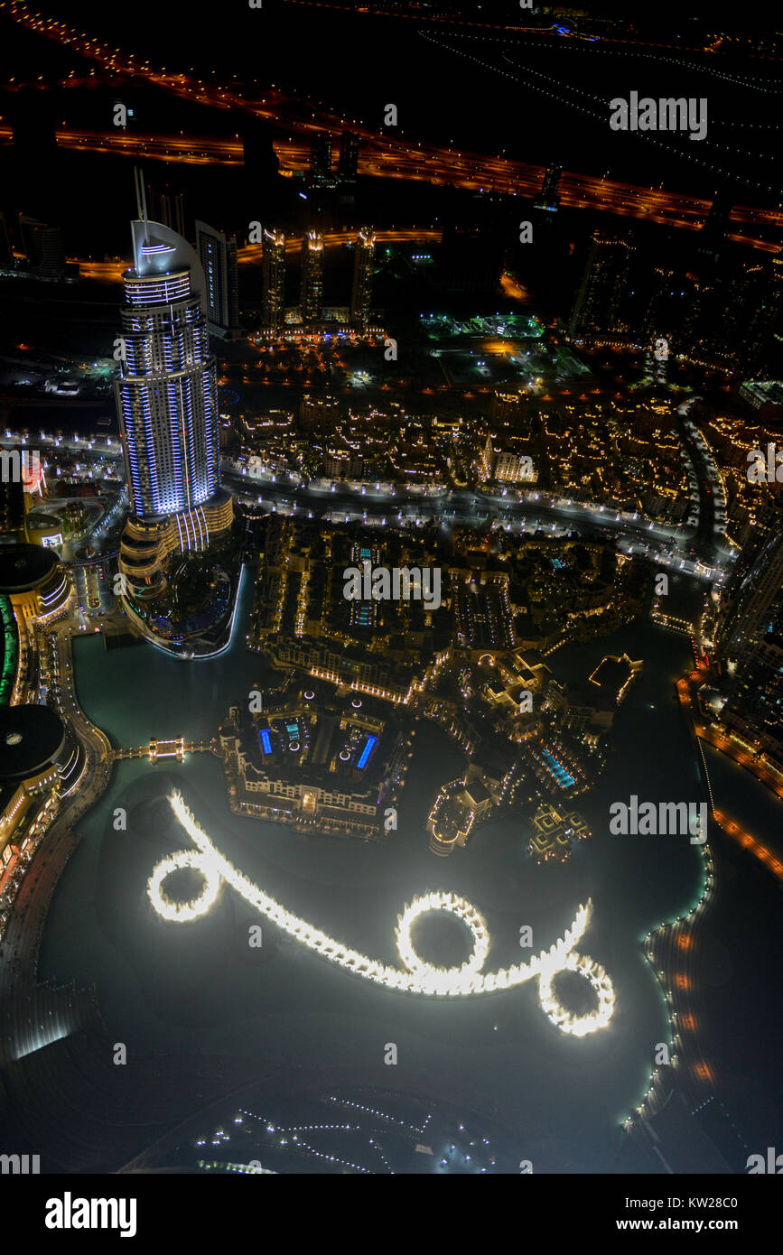 Aerial view of the skyline in Dubai, United Arab Emirates at night ...