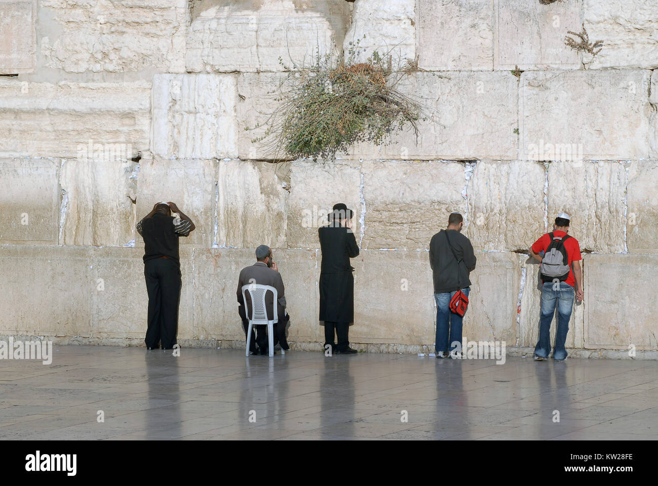 Western Wall in the Old City of Jerusalem: Jewish men stand near the ...