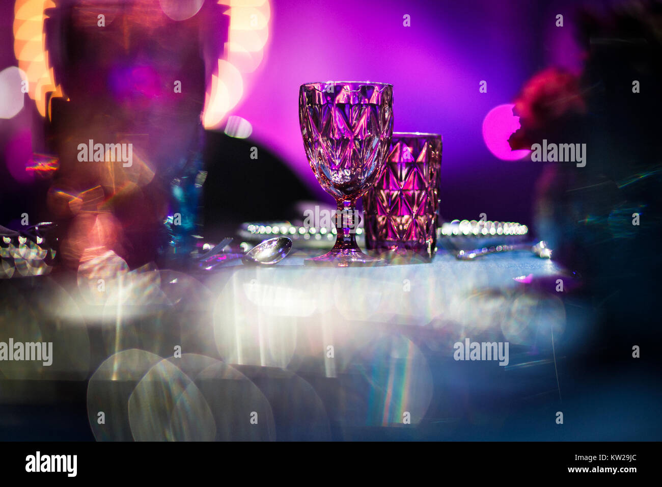 Glass goblets on the table set for wedding table Stock Photo - Alamy