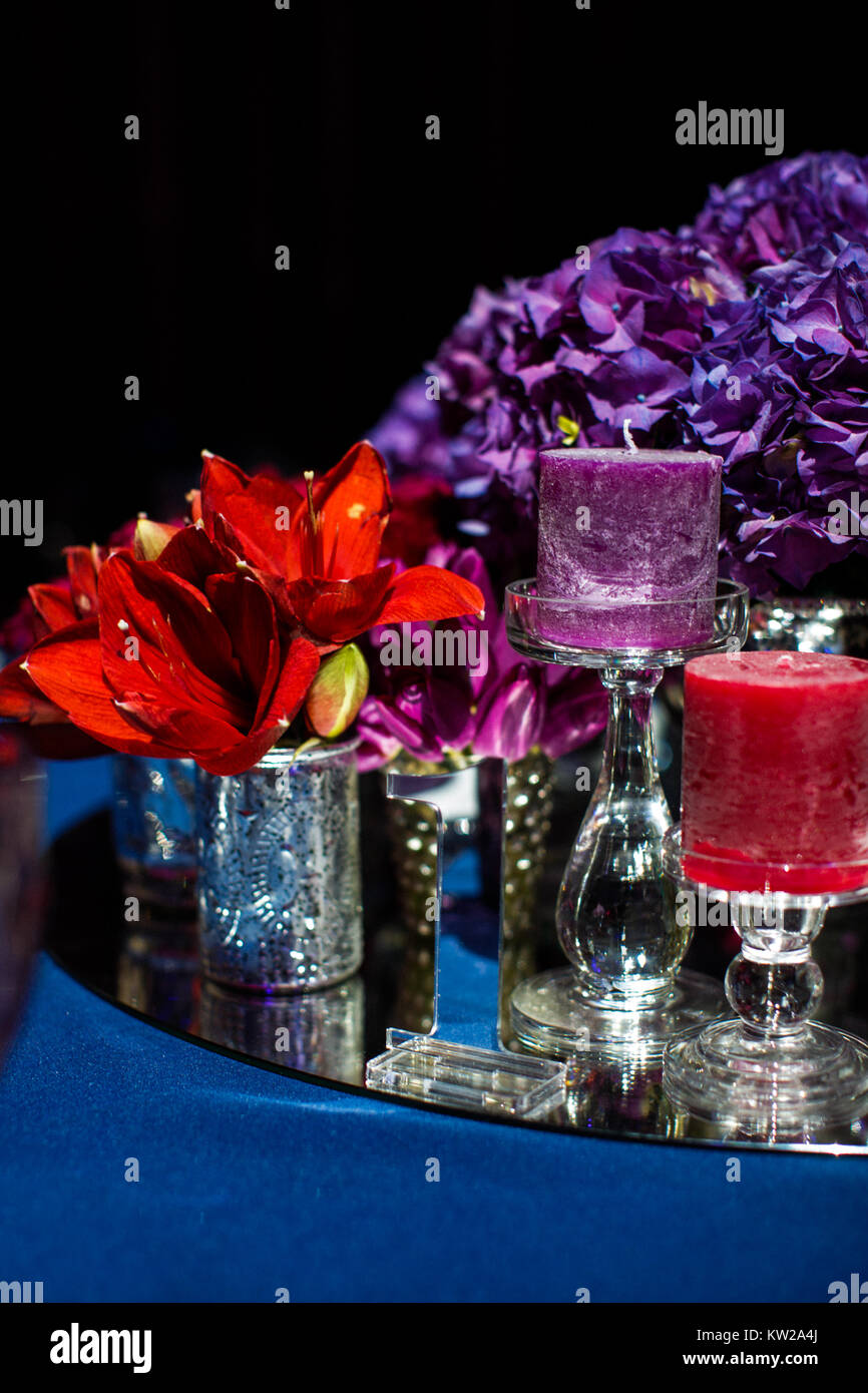 Candles, beautiful flowers and the table number on the wedding table ...